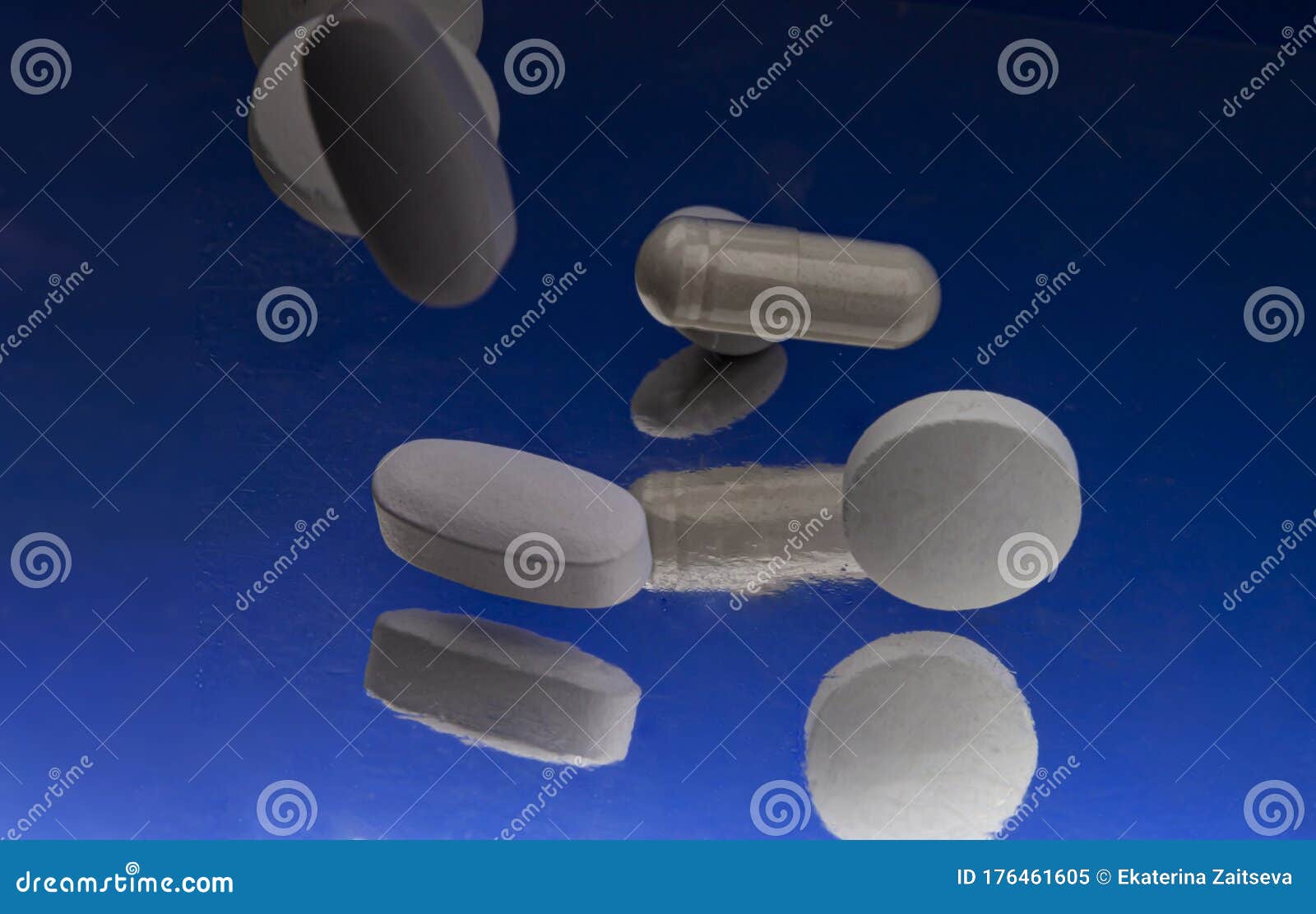 Falling White Pills, Tablets Capsule on Blue Backround. Anti Gravity ...