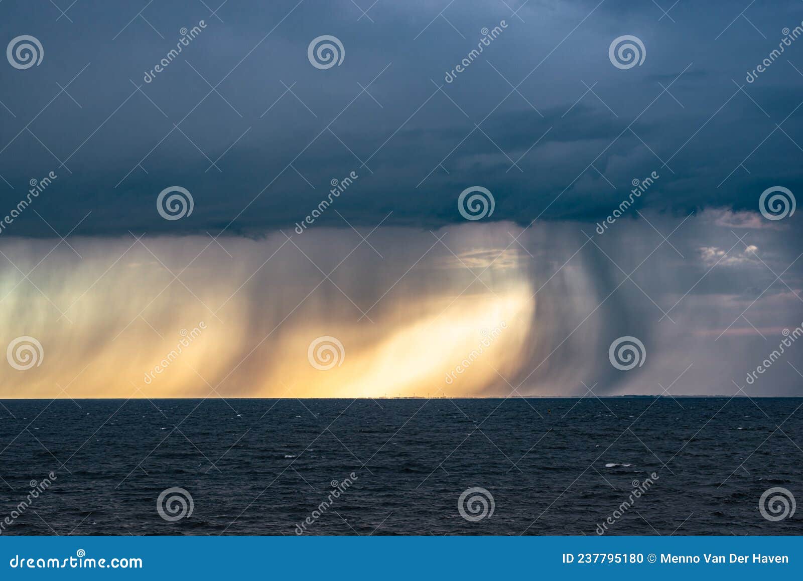 Fallstreaks of Rain and Hail from a Thunderstorm Over a Lake Stock ...