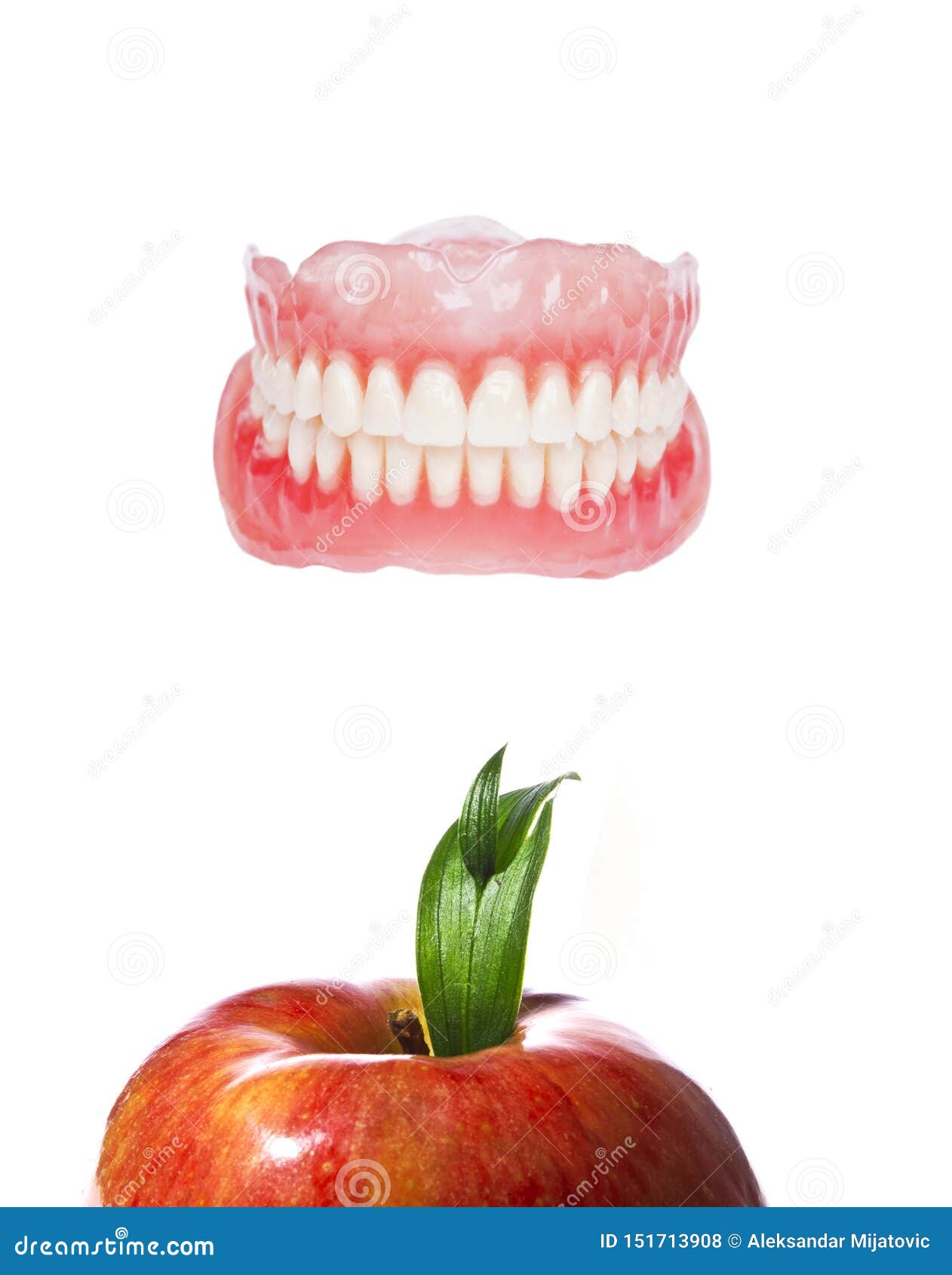 False or Fake Teeth with Red Fresh Apple - Healthy Teeth Concept Stock ...