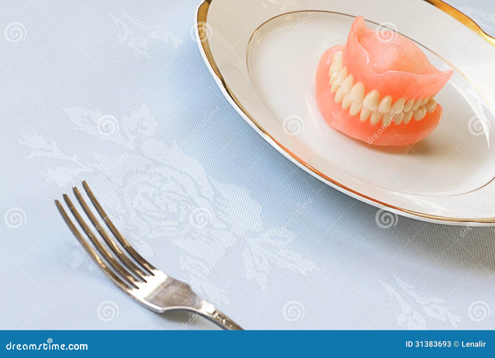 False teeth on white plate stock image. Image of hard - 31383693