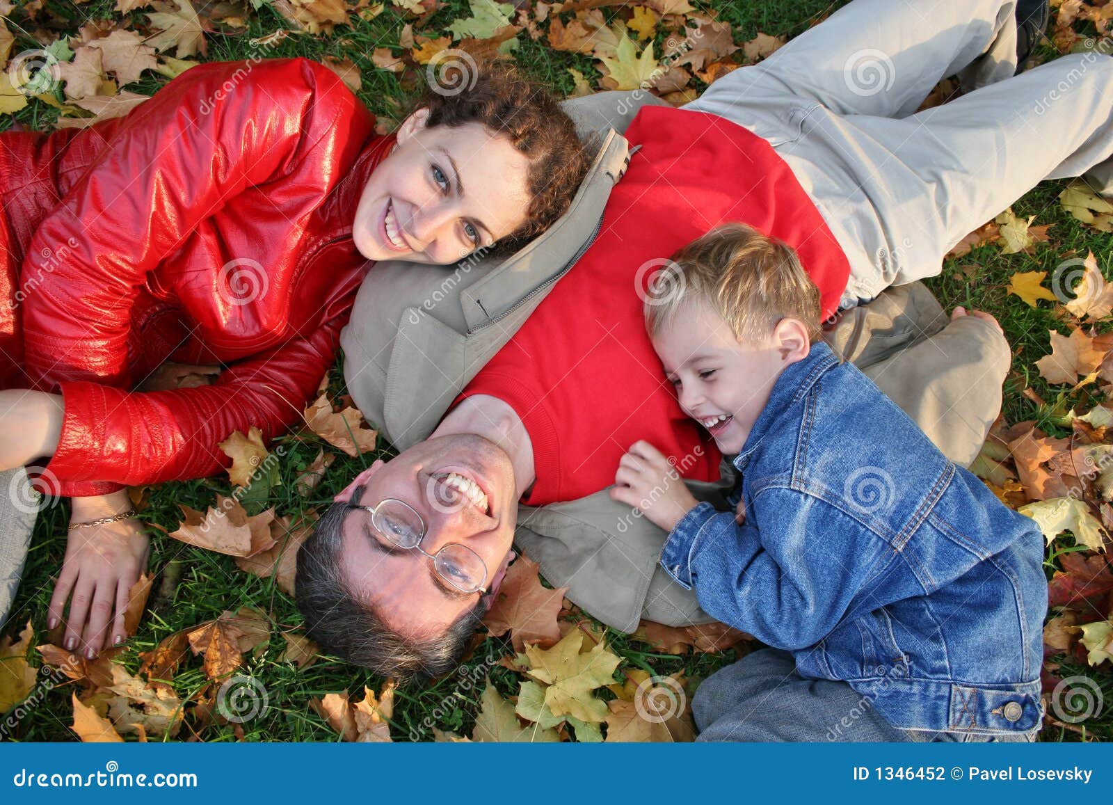 Family on autumn leaves stock photo. Image of funny, fall - 1346452