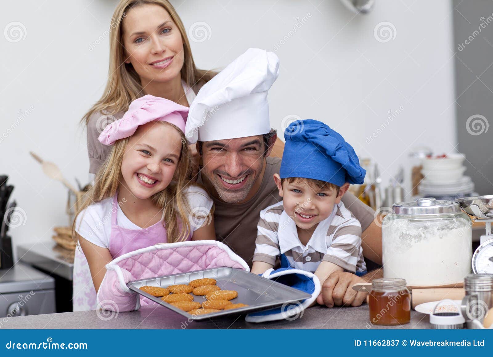 Family Baking And Eating Cookies In A Kitchen Royalty-Free Stock ...