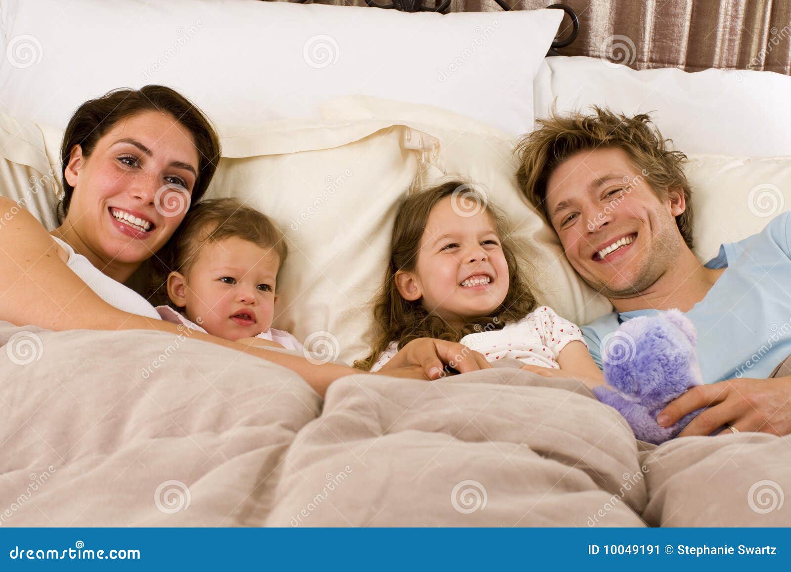 Family in bed stock image. Image of indoors, mother, girl - 10049191