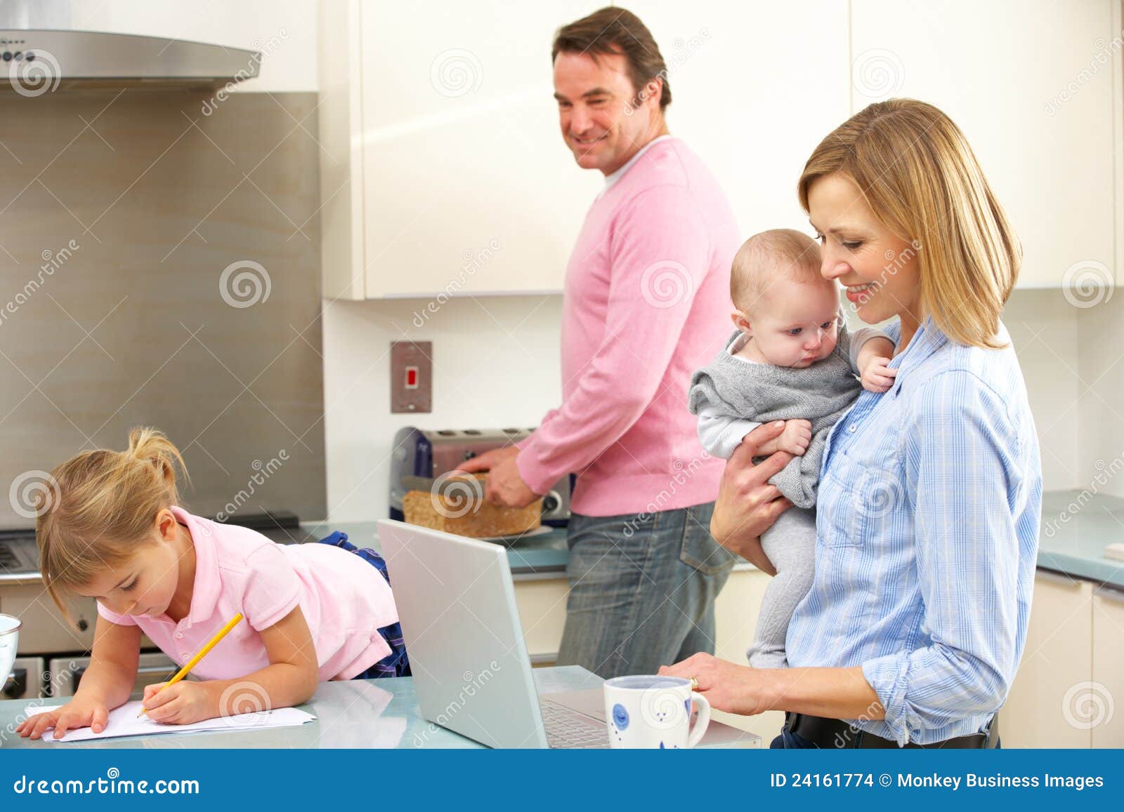 Family Busy Together in Kitchen Stock Photo - Image of forties, adult ...