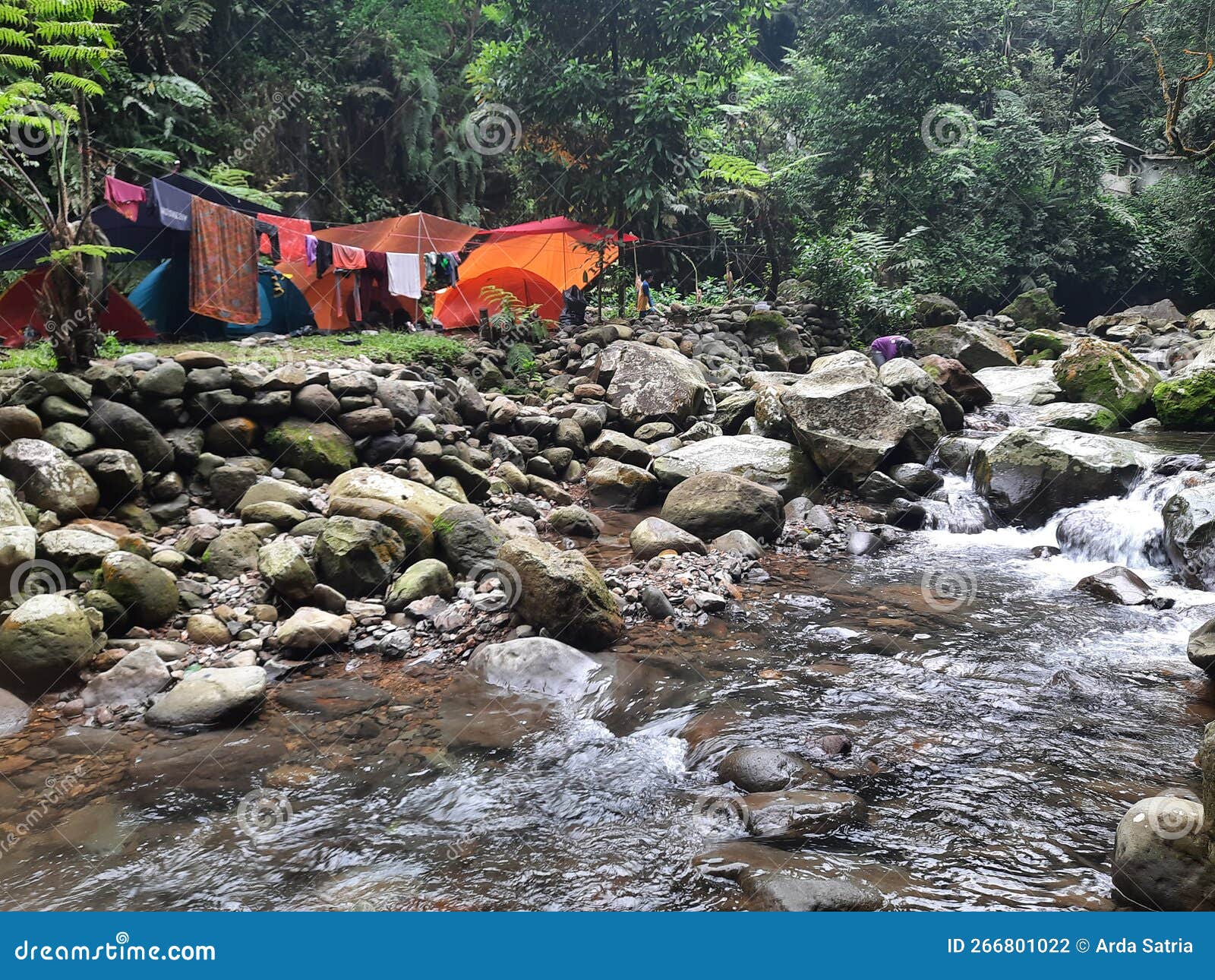 Family Camping in a Clear and Rocky Waterfall Stock Photo - Image of ...