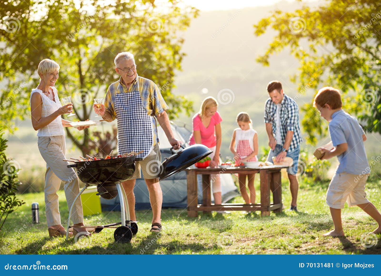 Family camping and cooking stock image. Image of food - 70131481