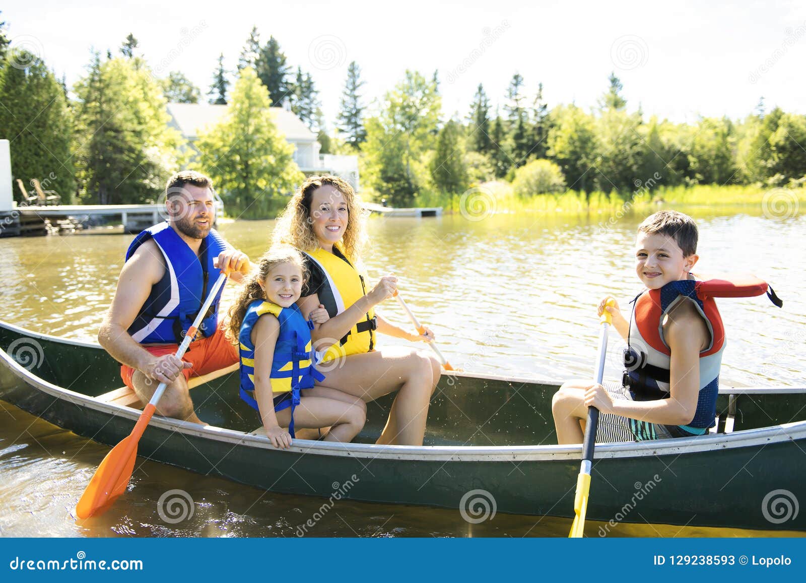 Family in a Canoe on a Lake Having Fun Stock Image - Image of stream ...
