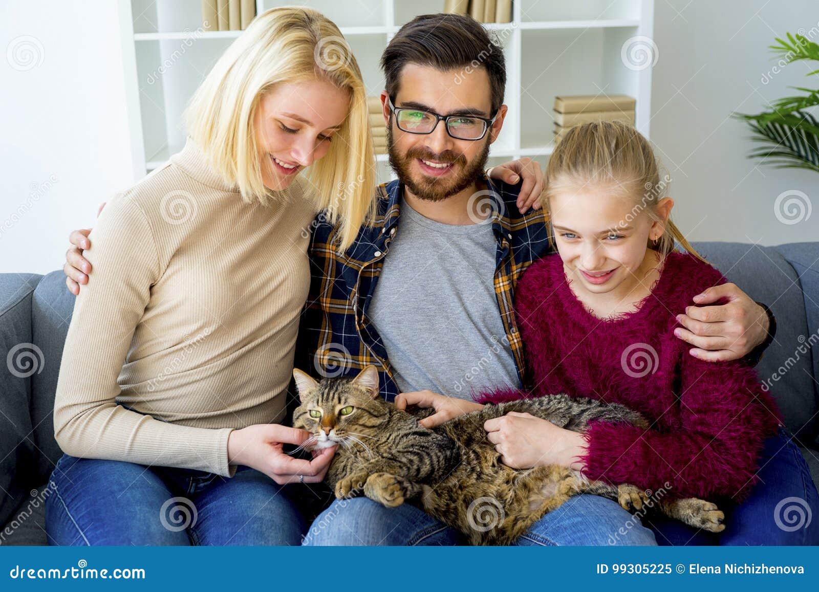 Family with a cat stock image. Image of daughter, cute - 99305225