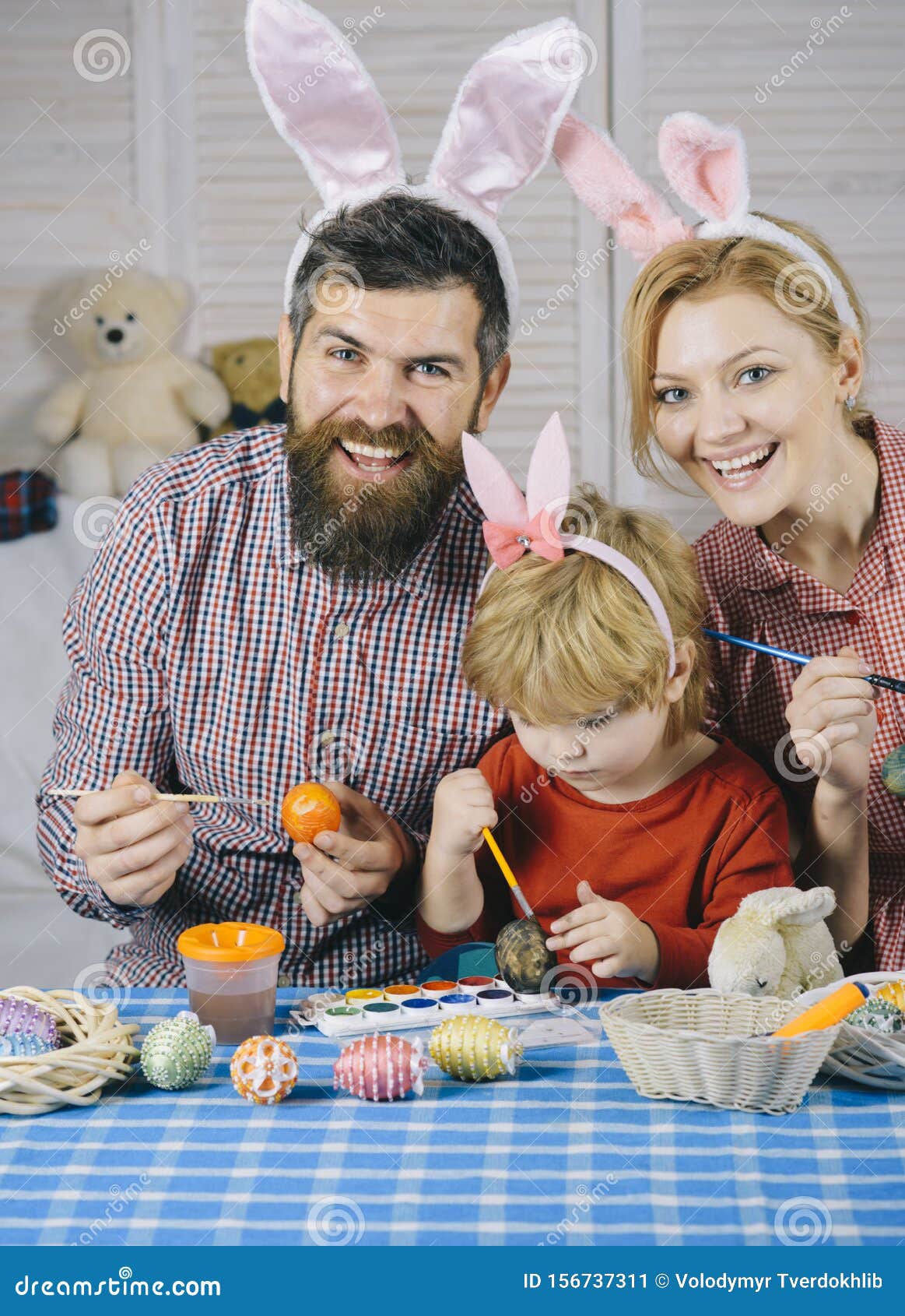 Family celebrating Easter stock image. Image of cute - 156737311