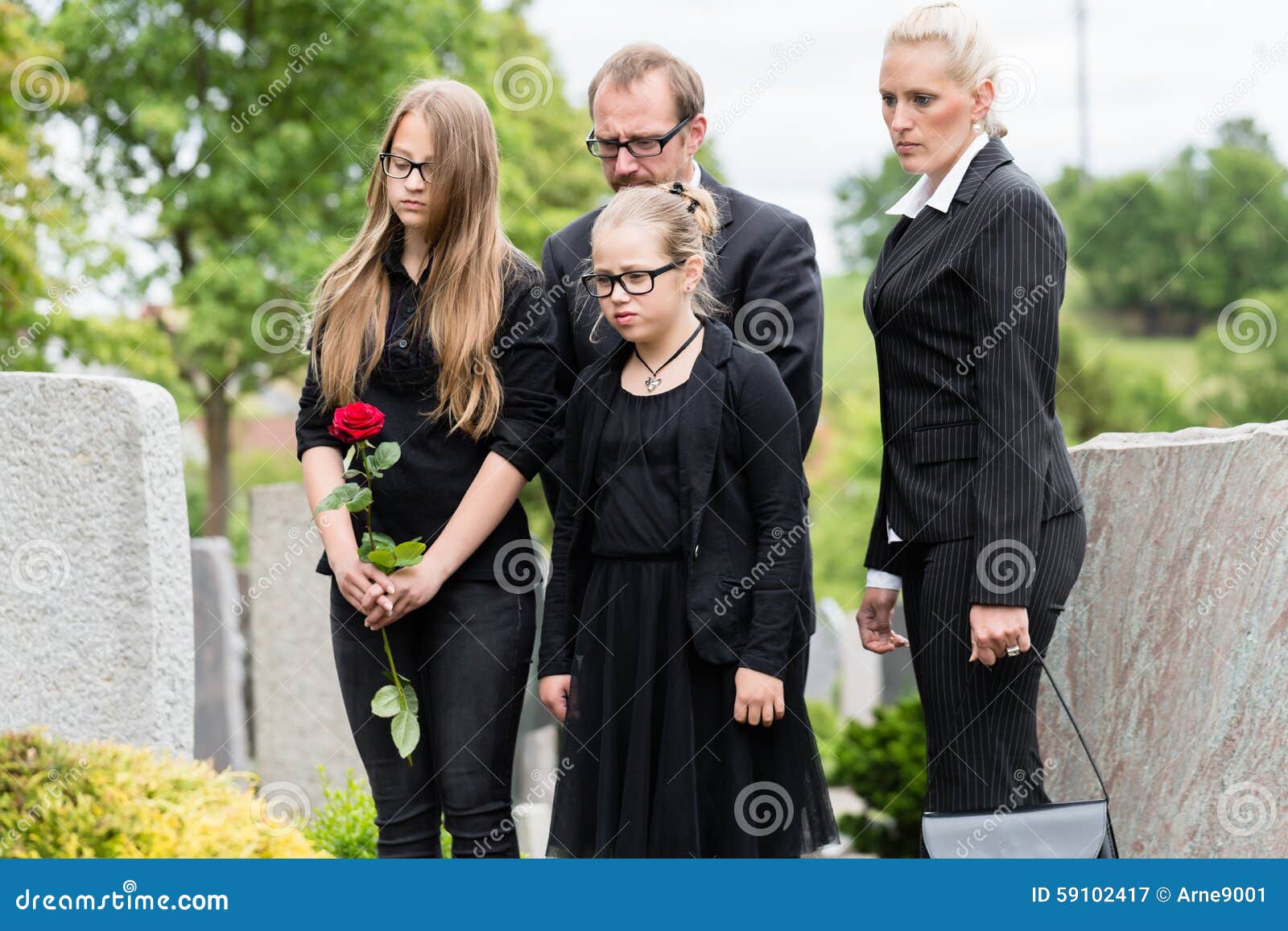 Family on Cemetery Mourning Deceased Relative Stock Image - Image of ...