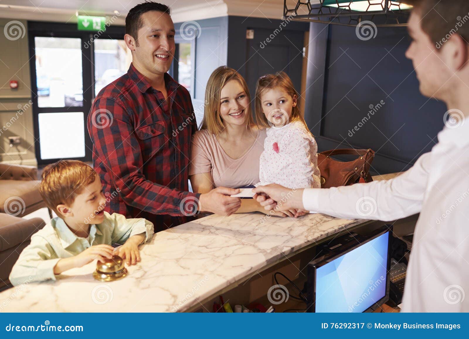 Family Checking in at Hotel Reception Desk Stock Image - Image of ...