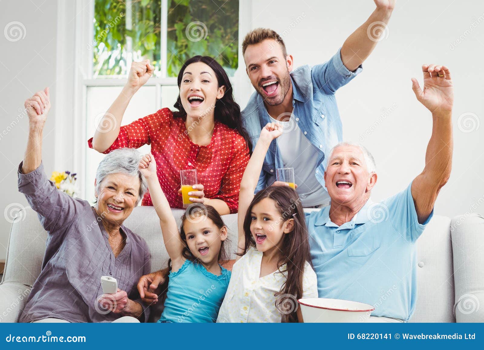 Family Cheering while Watching Television Stock Image - Image of girl ...