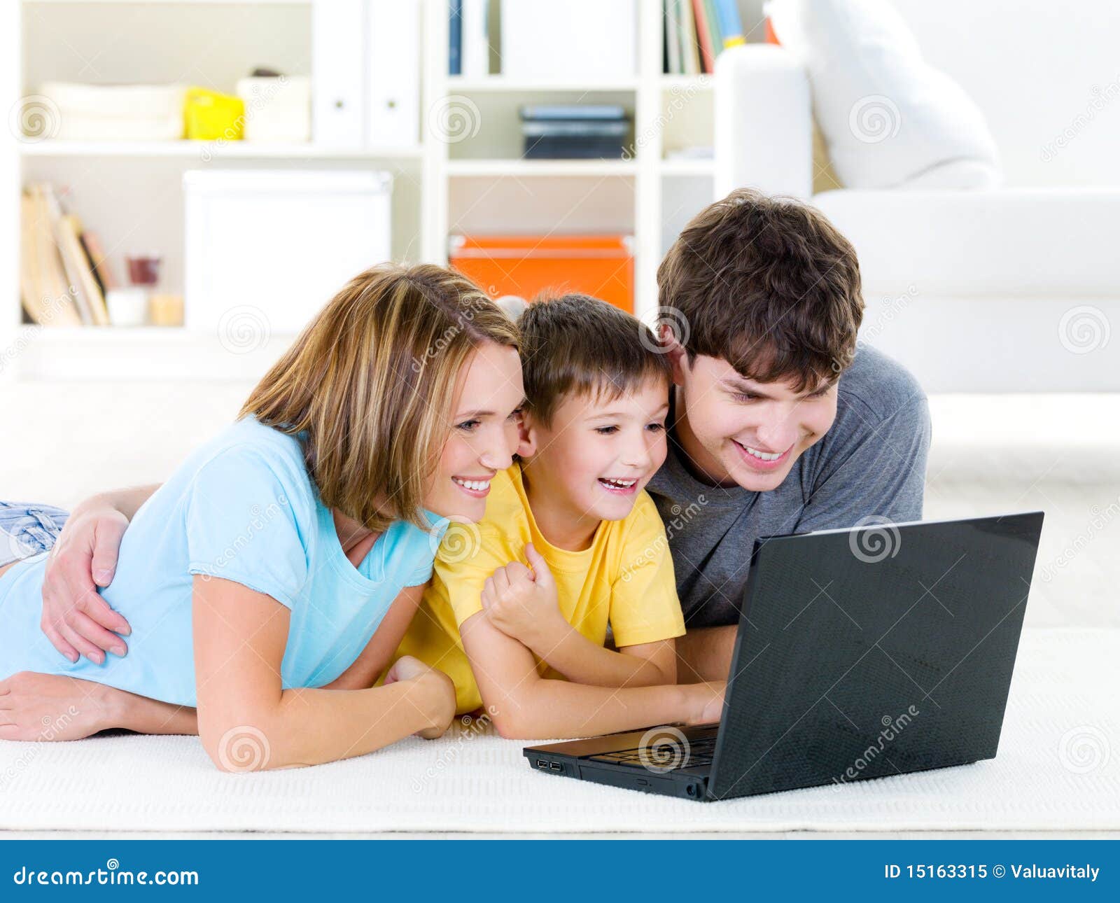 Family with Child Looking at Laptop Stock Image - Image of mother ...