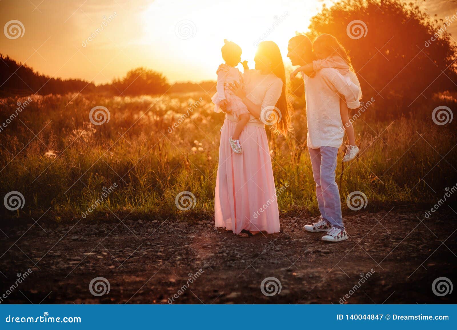 Family with Children at Sunset Stock Image - Image of holding, daddy ...