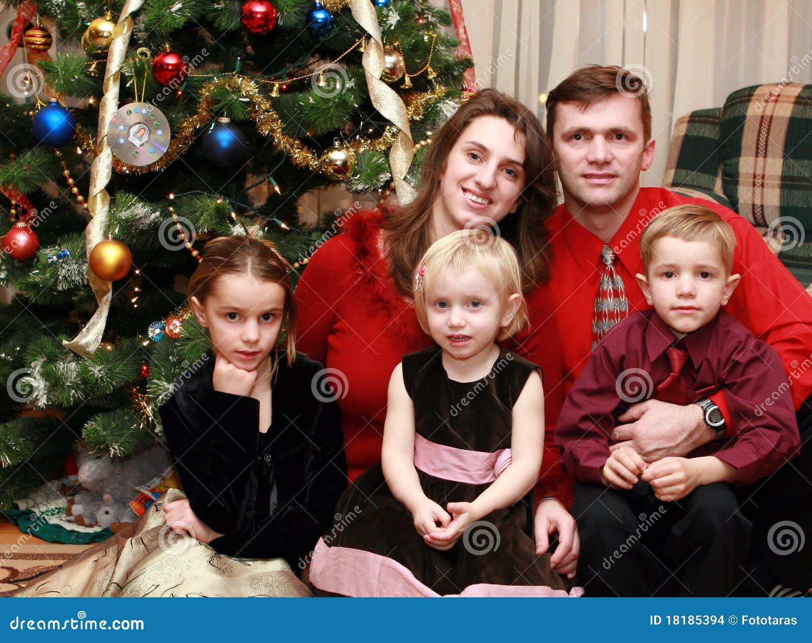 Family at the Christmas Tree Stock Photo - Image of cheerful, holiday ...