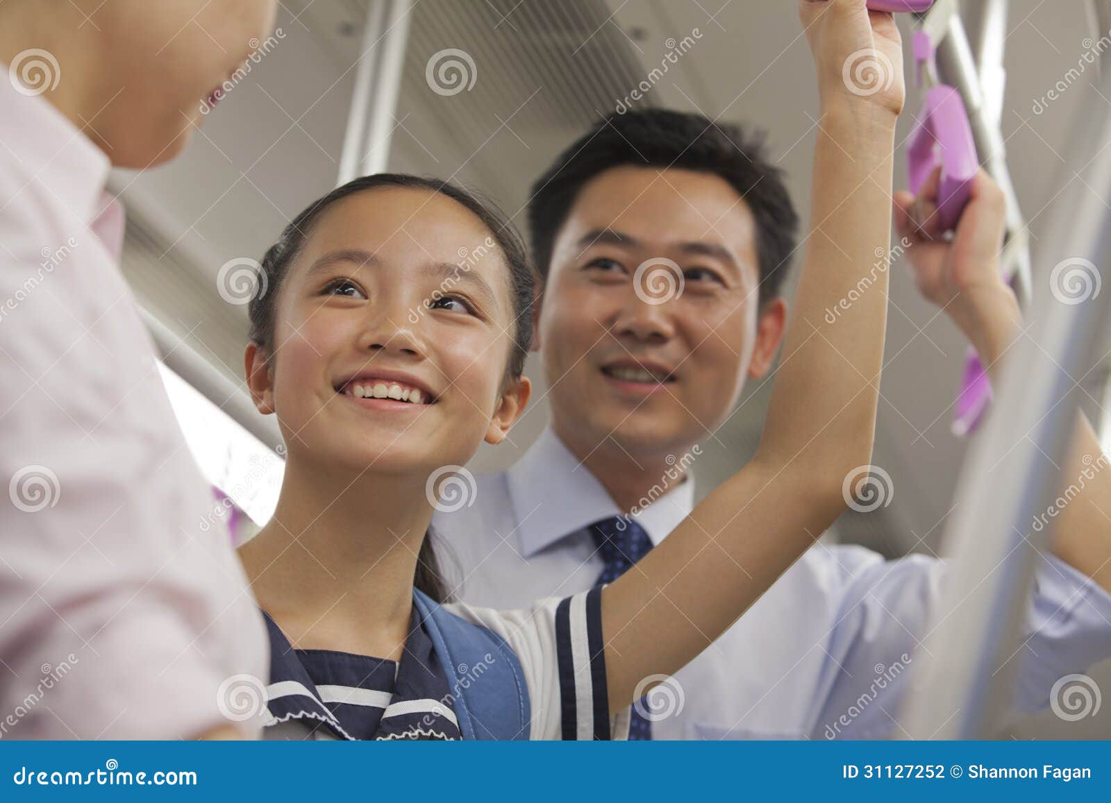 Family Commuting Together and Smiling in the Subway Stock Photo - Image ...