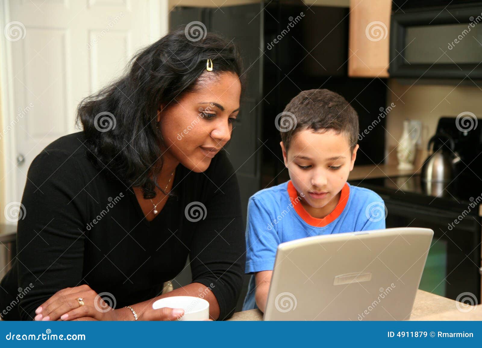 Family on Computer stock image. Image of home, interracial - 4911879