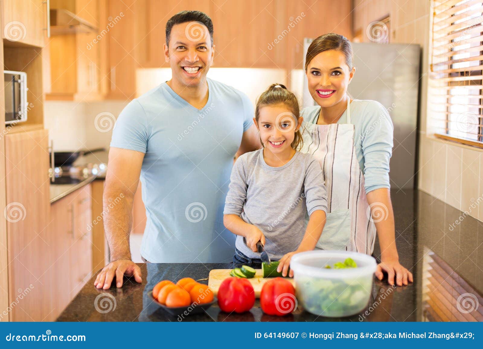 Family cooking together stock image. Image of chopping - 64149607
