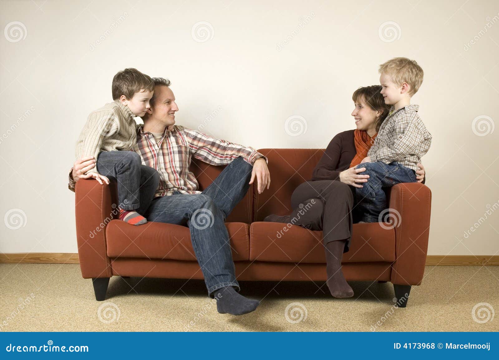 Family on a Couch 1 stock photo. Image of cosiness, double - 4173968