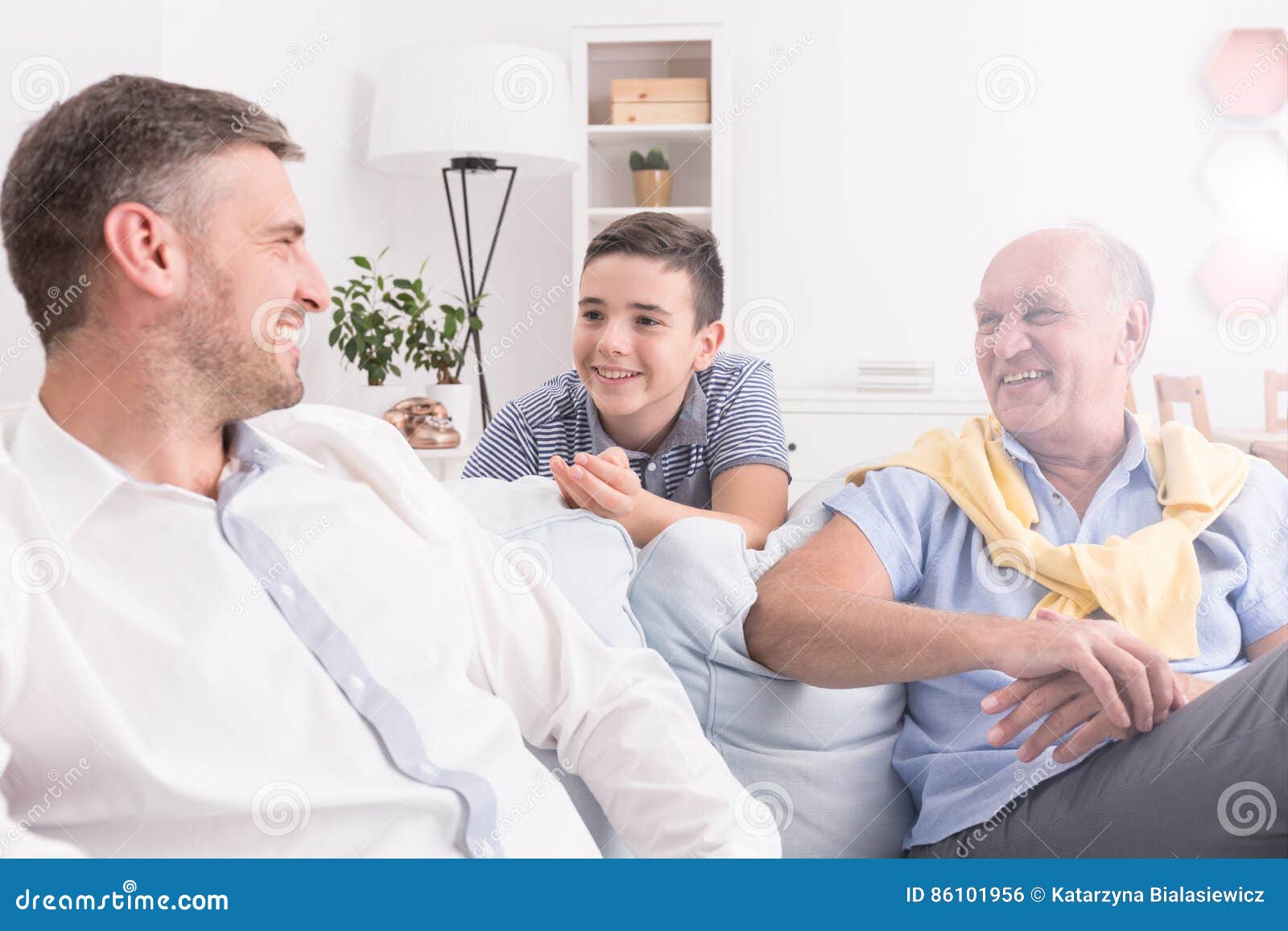 Family on a couch stock photo. Image of family, love - 86101956