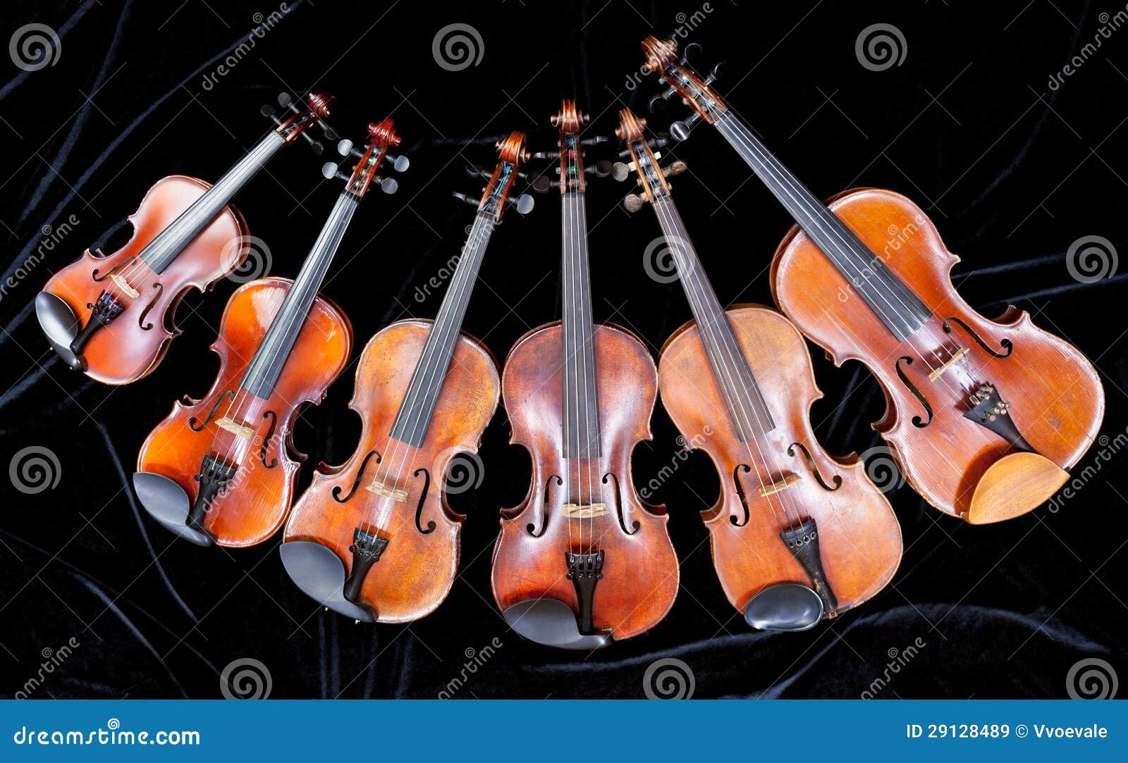 Family of Different Sized Violins on Black Stock Image - Image of bout ...