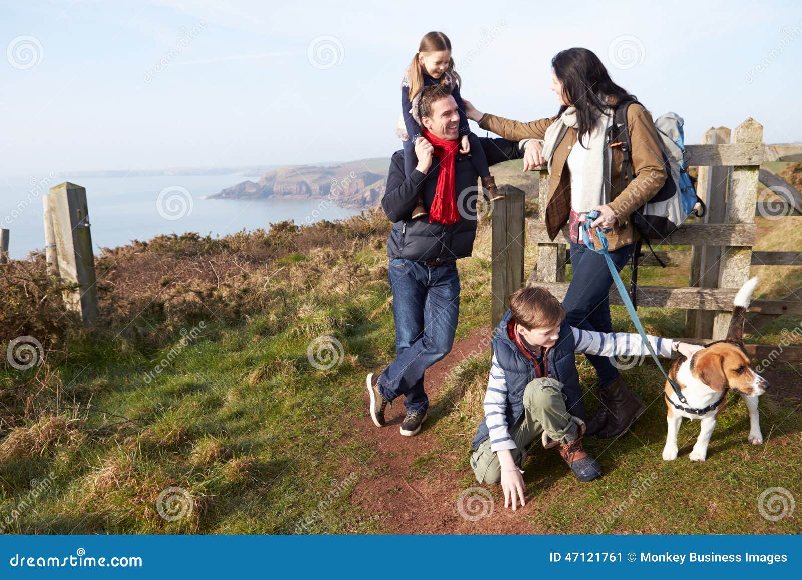 Family with Dog Walking Along Coastal Path Stock Image - Image of ...