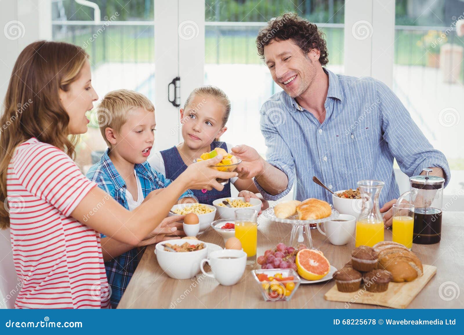 Family Doing Breakfast in House Stock Photo - Image of focus, family ...
