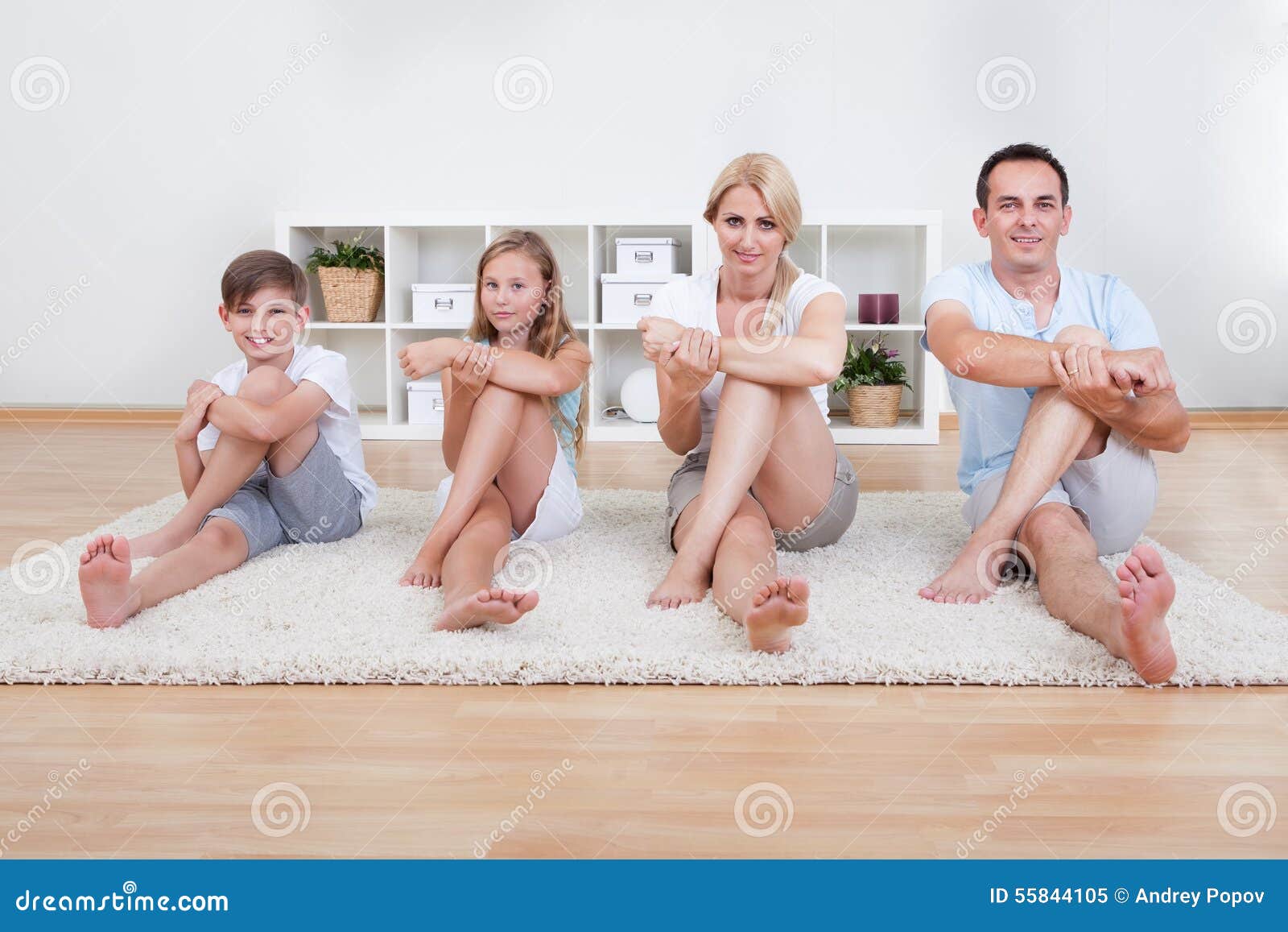 Family Doing Stretching Exercises Stock Image - Image of girls, indoors ...