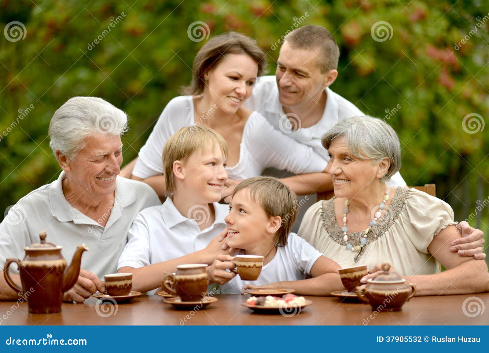 Family Drinking Tea Outdoors Stock Photo - Image of boys, nature: 37905532