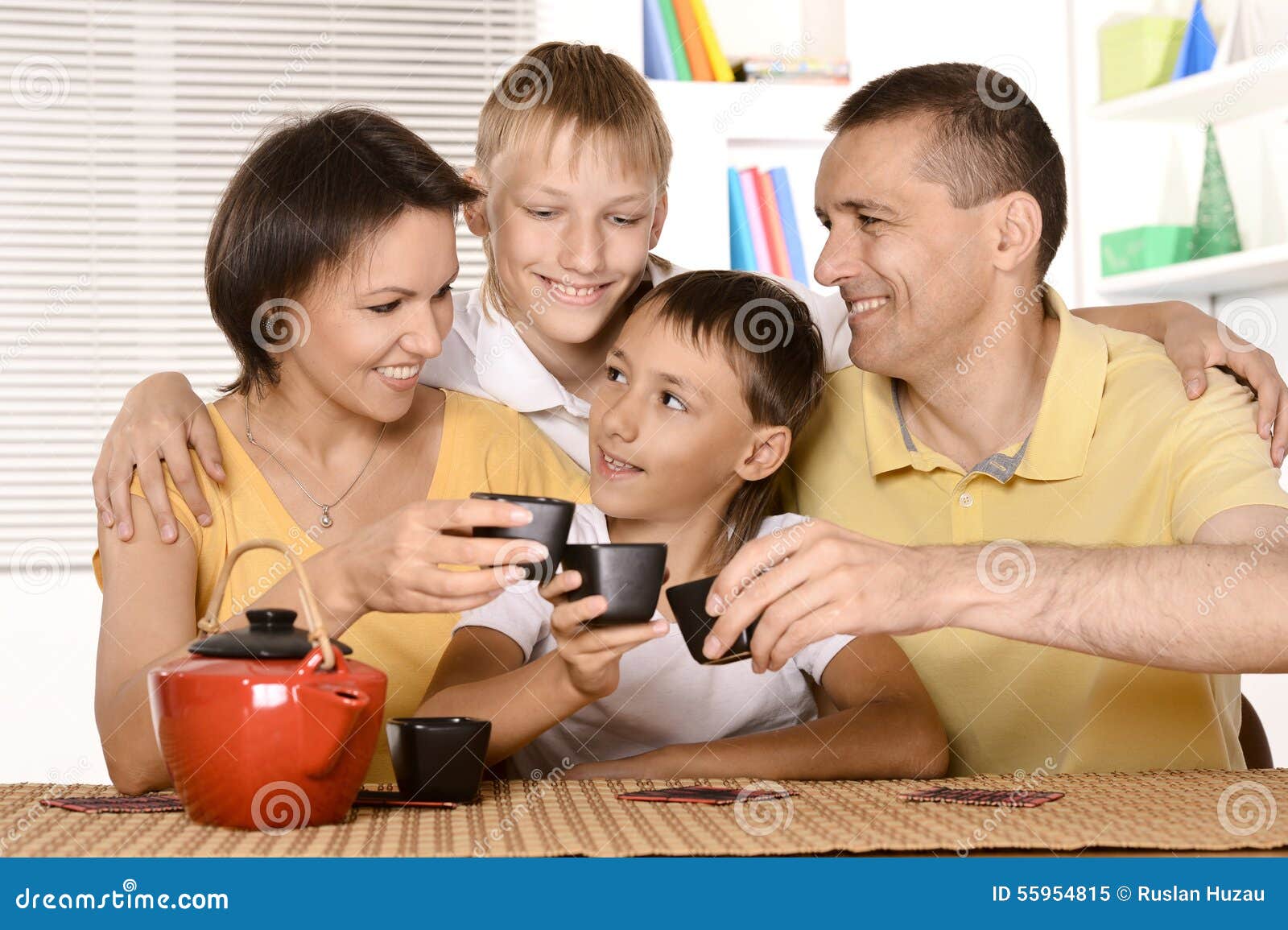 Family Drinking Tea at Table Stock Image - Image of people, five: 55954815