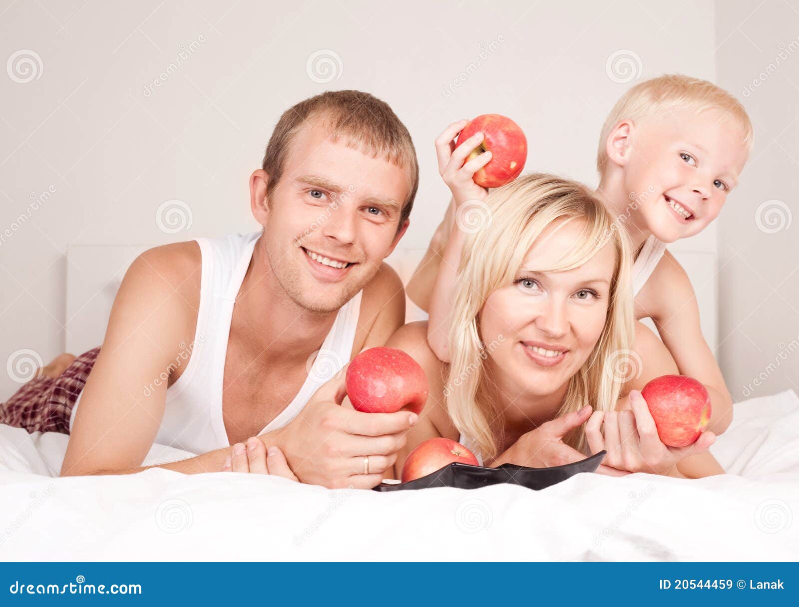 Family eating apples stock image. Image of motherhood - 20544459