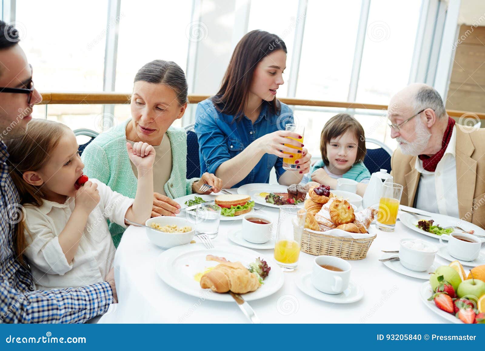 Family eating stock photo. Image of grandchild, juice - 93205840