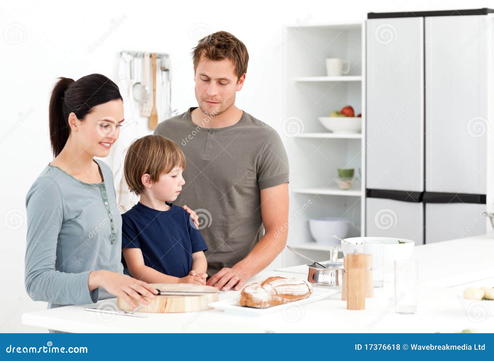 Family Eating Bread in the Kitchen Stock Photo - Image of healthy ...
