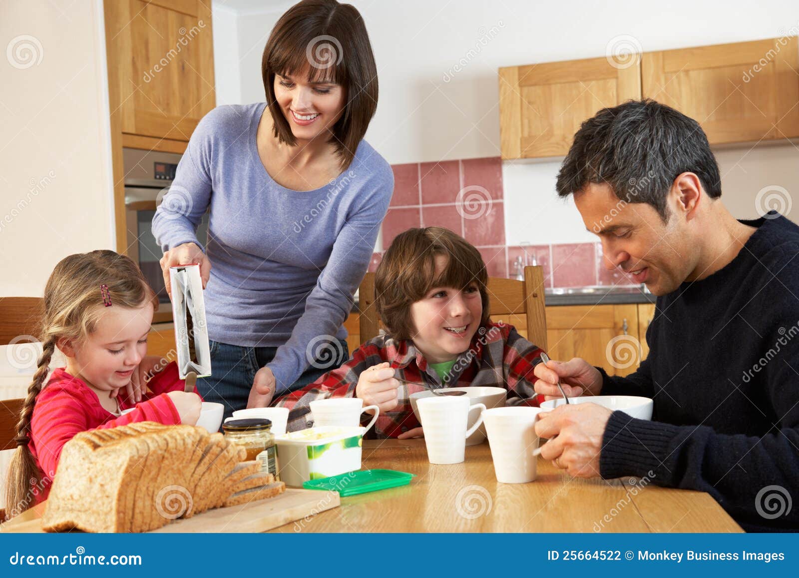 Family Eating Breakfast Together in Kitchen Stock Photo - Image of ...