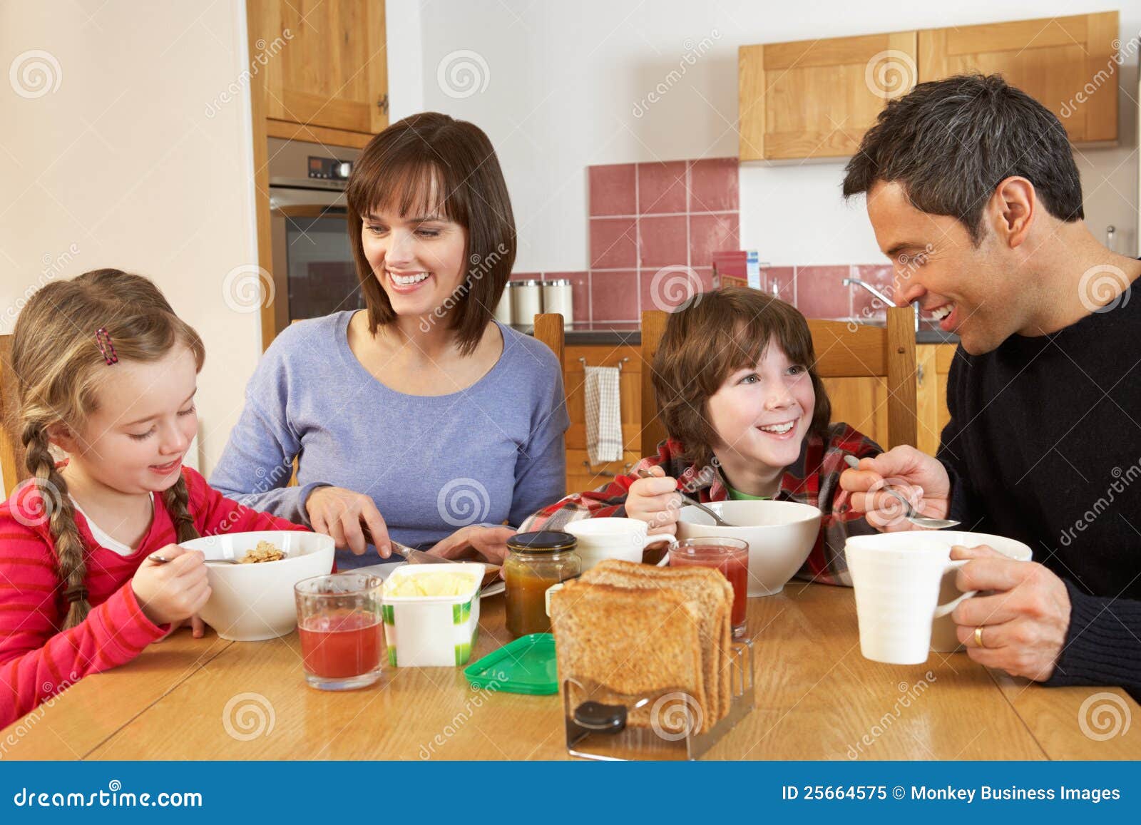 Family Eating Breakfast Together in Kitchen Stock Image - Image of home ...
