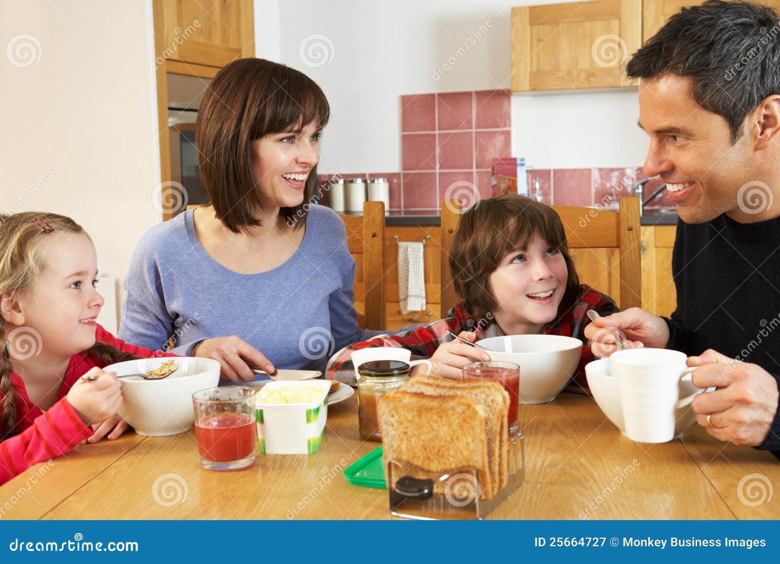 Family Eating Breakfast Together in Kitchen Stock Image - Image of ...