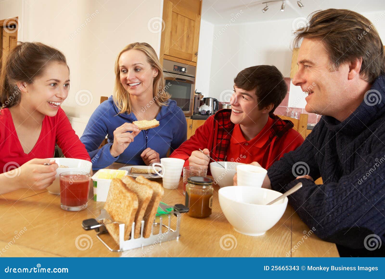 Family Eating Breakfast Together in Kitchen Stock Image - Image of ...