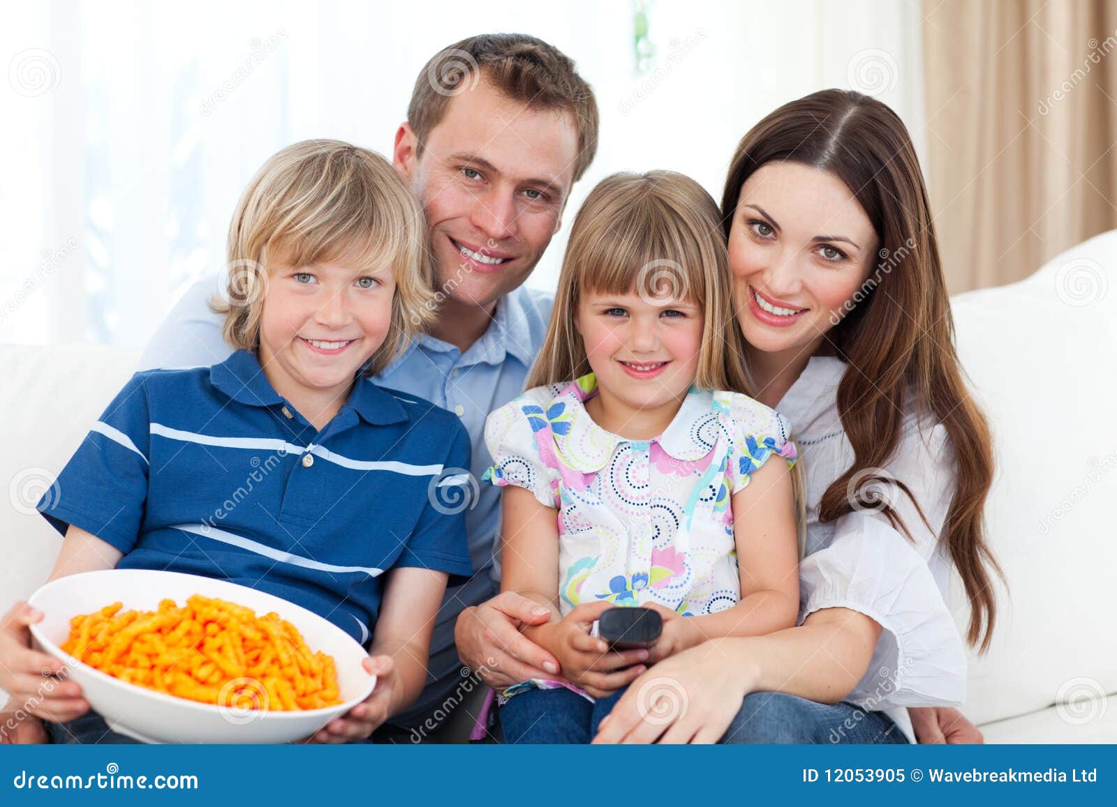 Family Eating Crisps on the Sofa Stock Image - Image of love, home ...