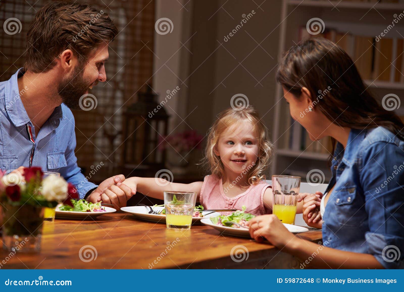Family Eating Dinner at a Dining Table Stock Photo - Image of domestic ...