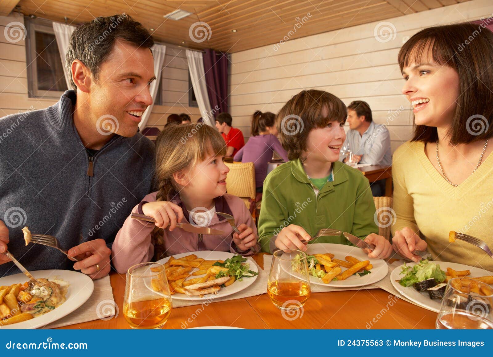 Family Eating Lunch Together in Restaurant Stock Image - Image of ...