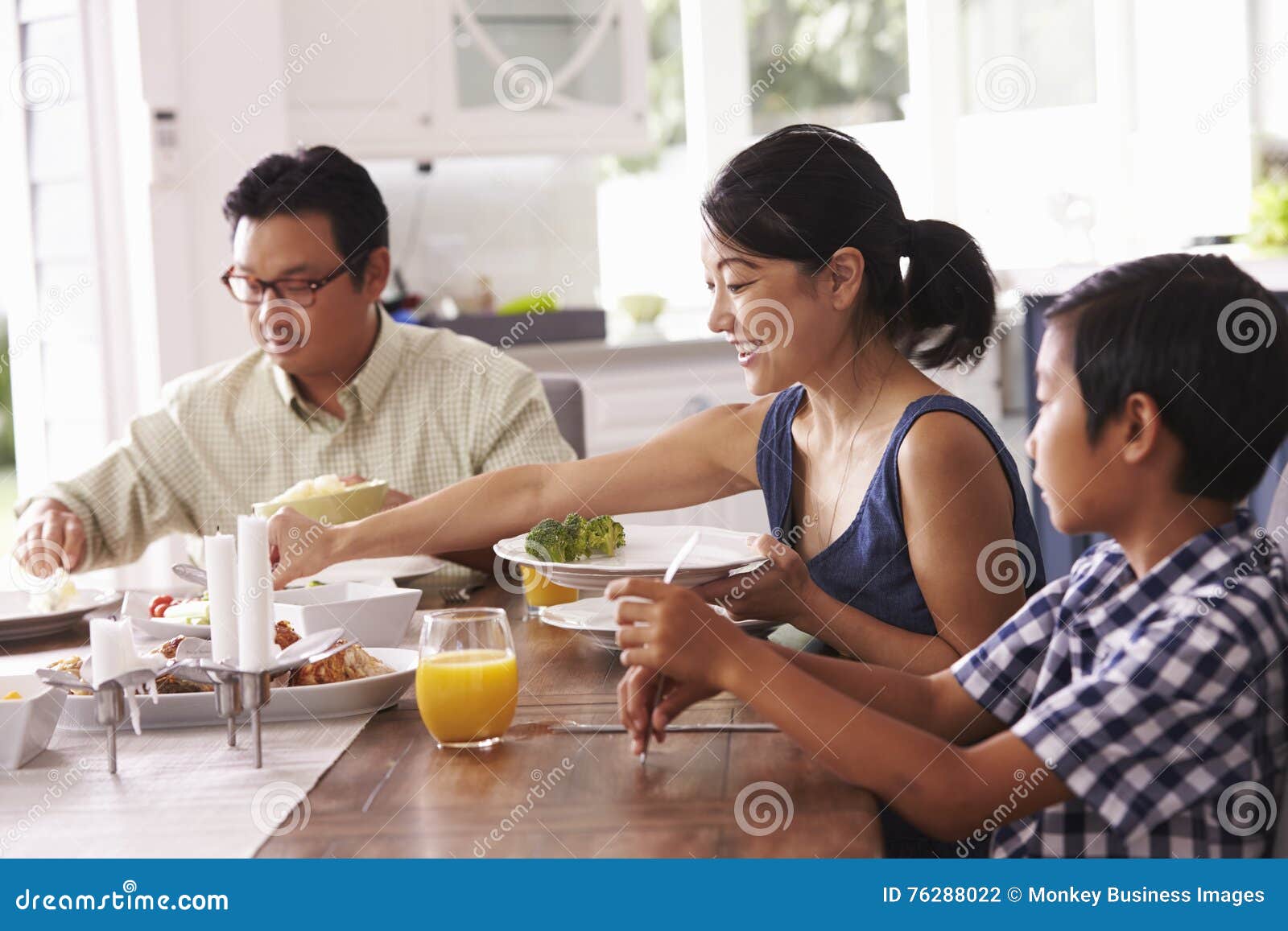 Family Eating Meal at Home Together Stock Photo - Image of table, woman ...