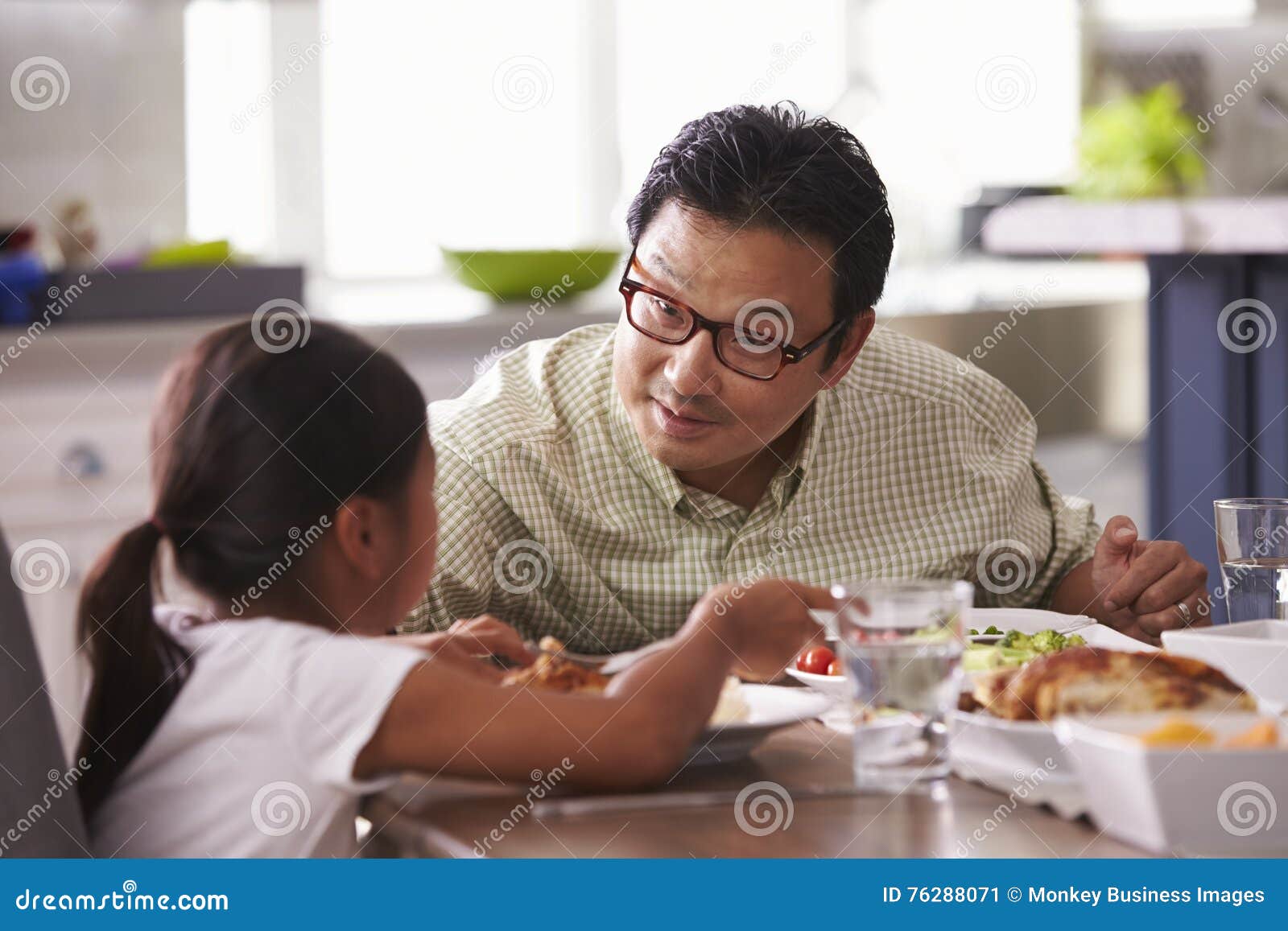 Family Eating Meal at Home Together Stock Image - Image of happy ...