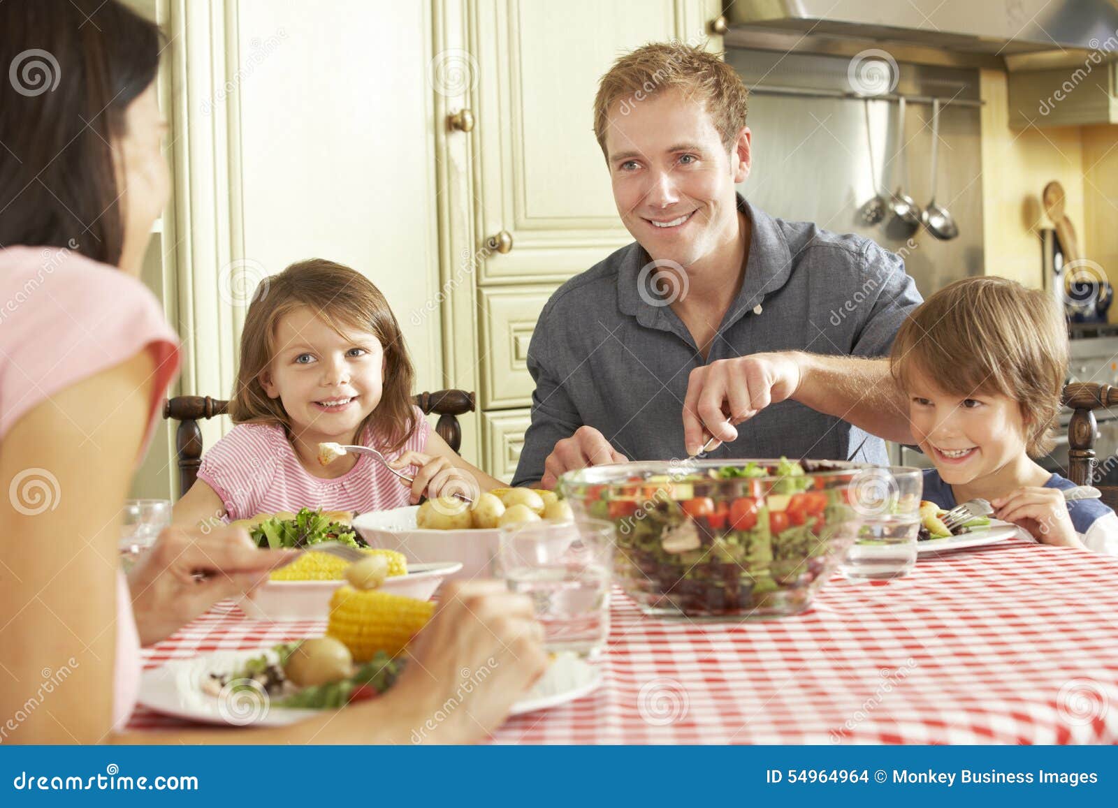 Family Eating Meal Together in Kitchen Stock Photo - Image of daughter ...