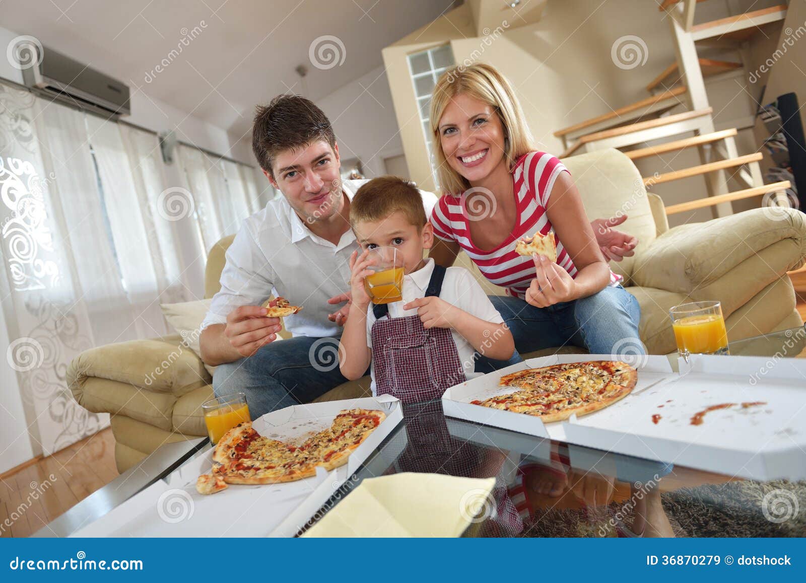 Family eating pizza stock image. Image of happy, kids - 36870279