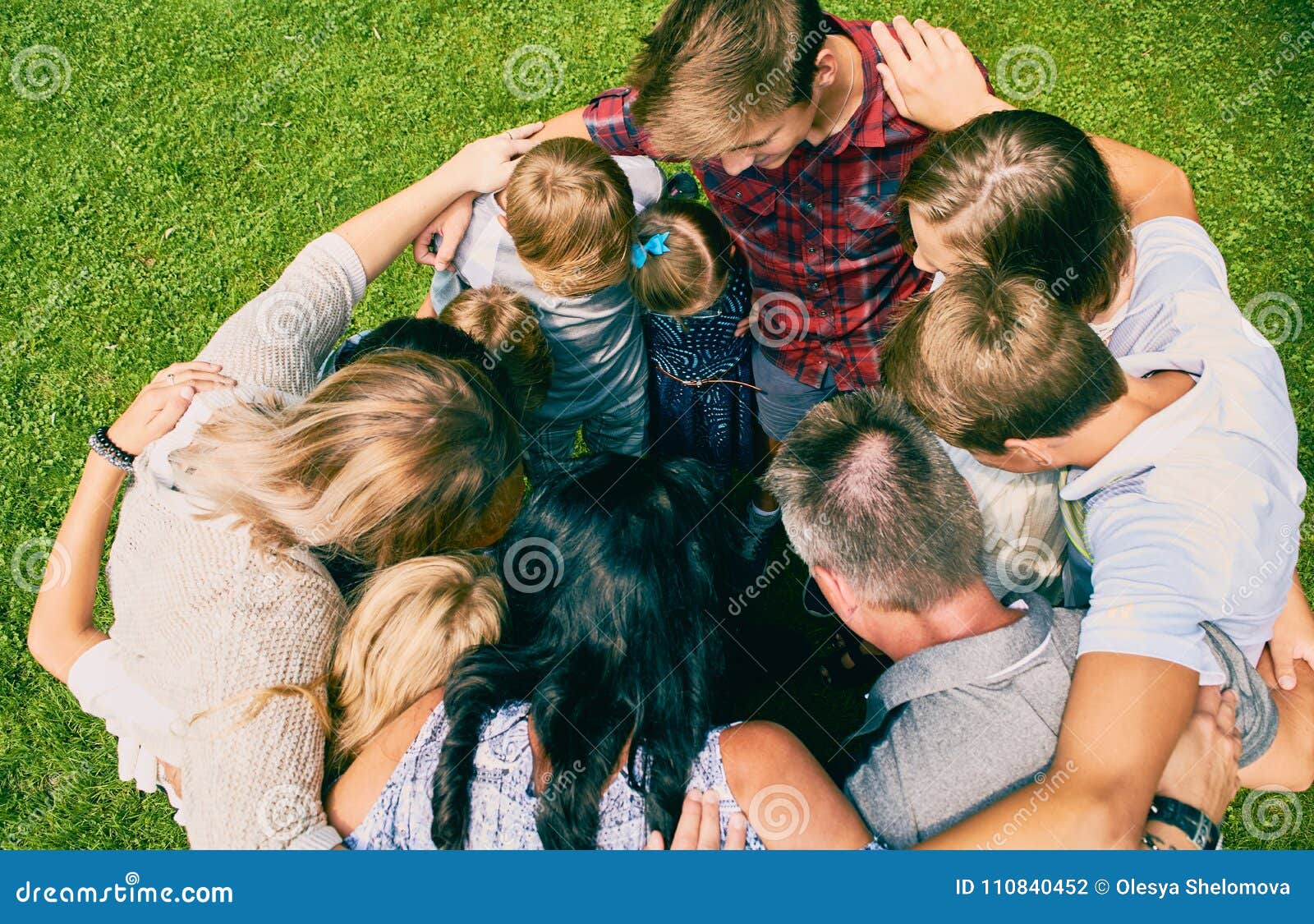 Family of Eleven Standing Embracing in Circle Stock Photo - Image of ...