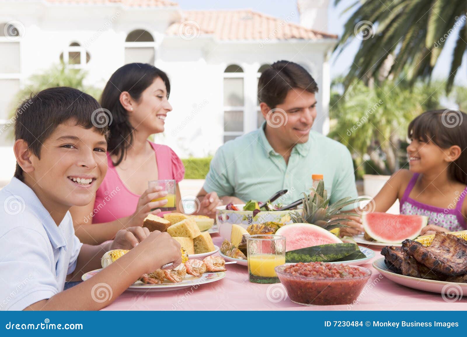Family Enjoying a Barbeque stock photo. Image of husband - 7230484