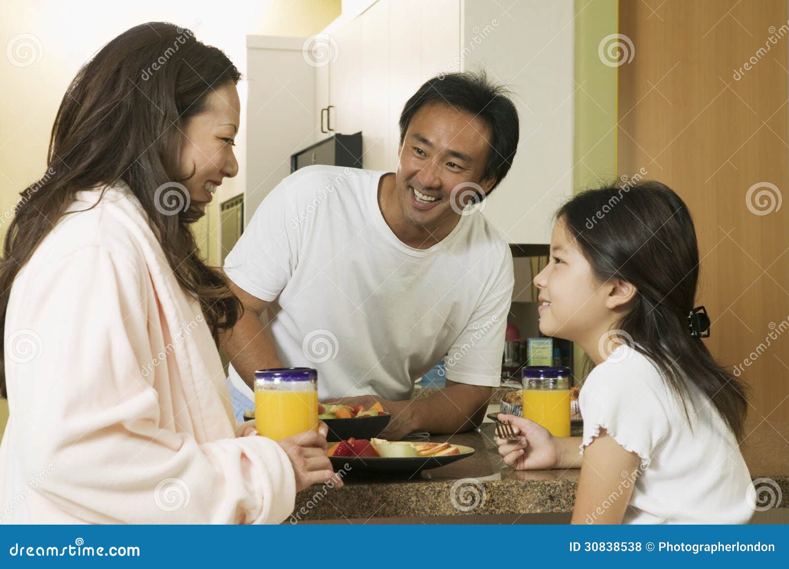 Family Enjoying Breakfast in Kitchen Stock Photo - Image of asians ...
