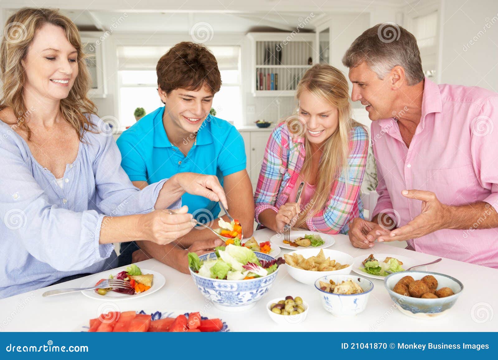 Family enjoying meal stock photo. Image of father, enjoying - 21041870