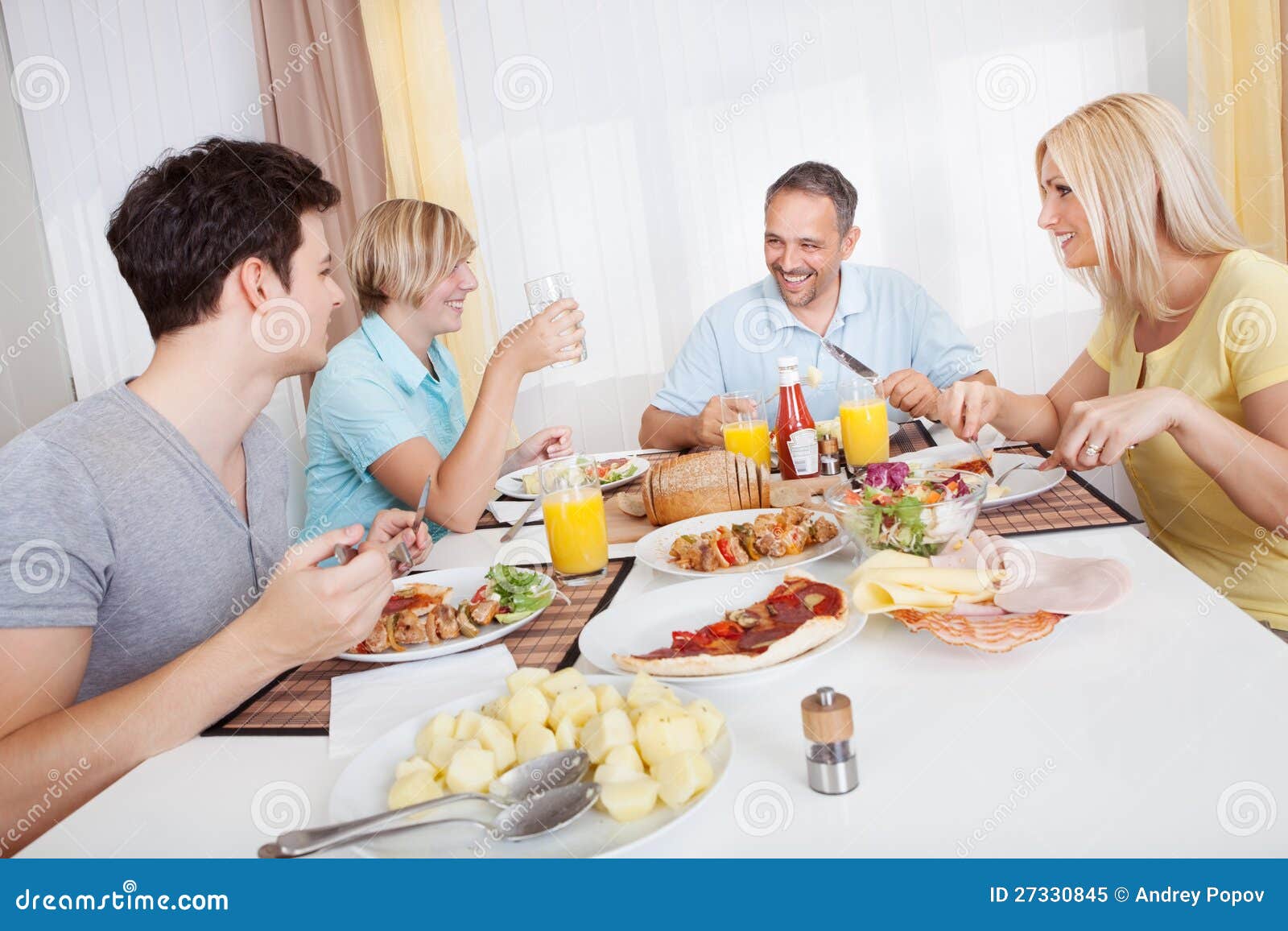 Family Enjoying a Meal Together Stock Image - Image of diet, indoors ...