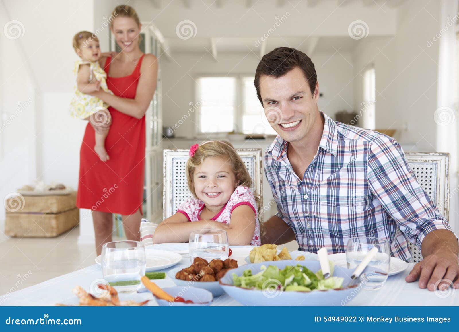 Family Enjoying Meal Together at Home Stock Photo - Image of food ... Family Enjoying Meal Together at Home Stock Photo - Image of food ...